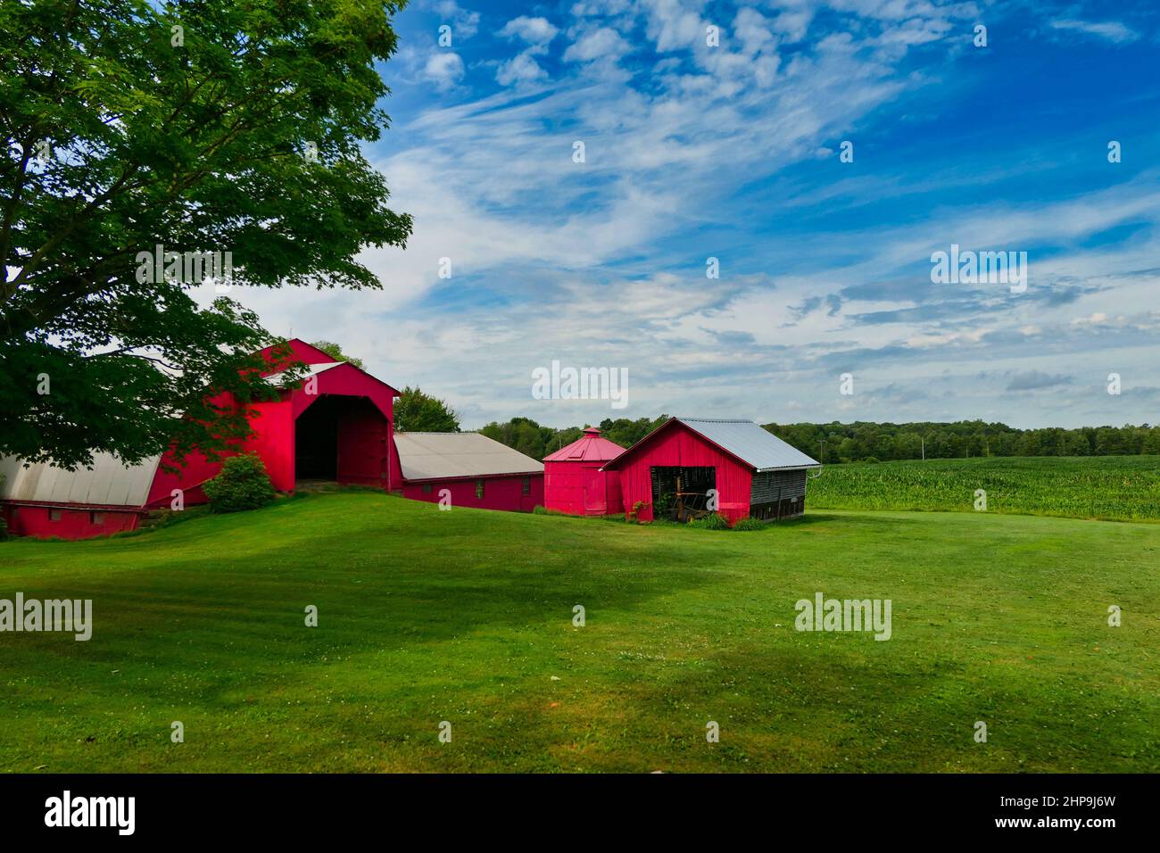 Beautiful view of red barn on the farm in Pennsylvania with a blue sky ...