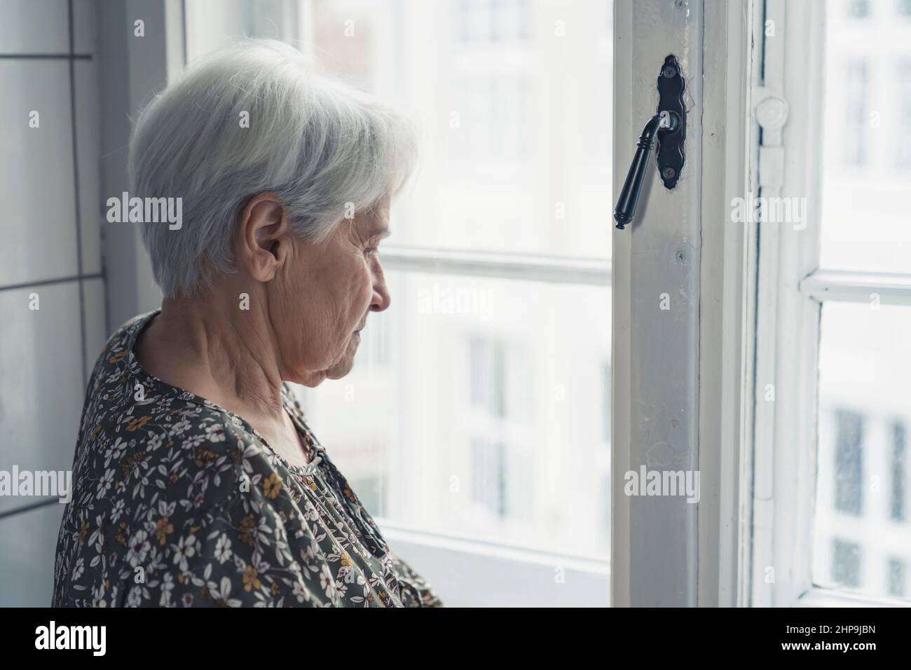 Old woman window dementia hi-res stock photography and images - Alamy