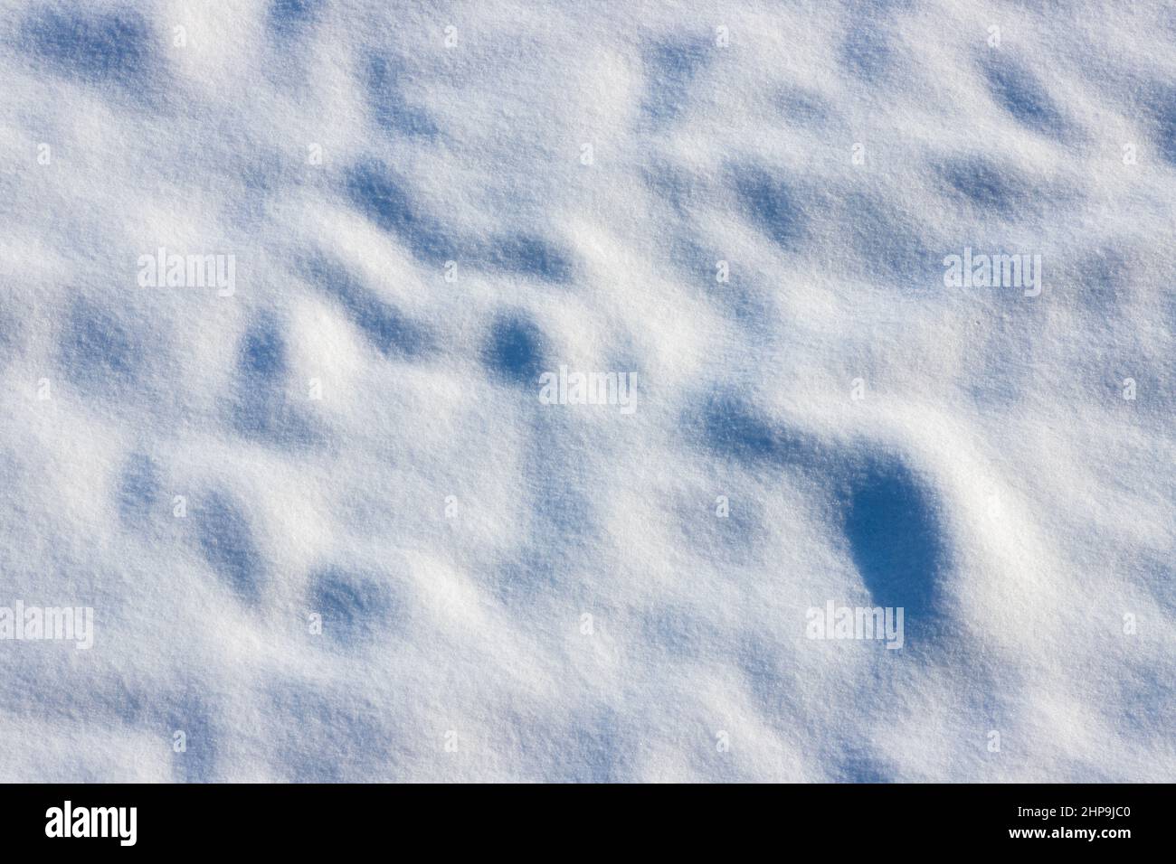 Closeup shot of the pure white snow surface on a cold sunny day Stock ...