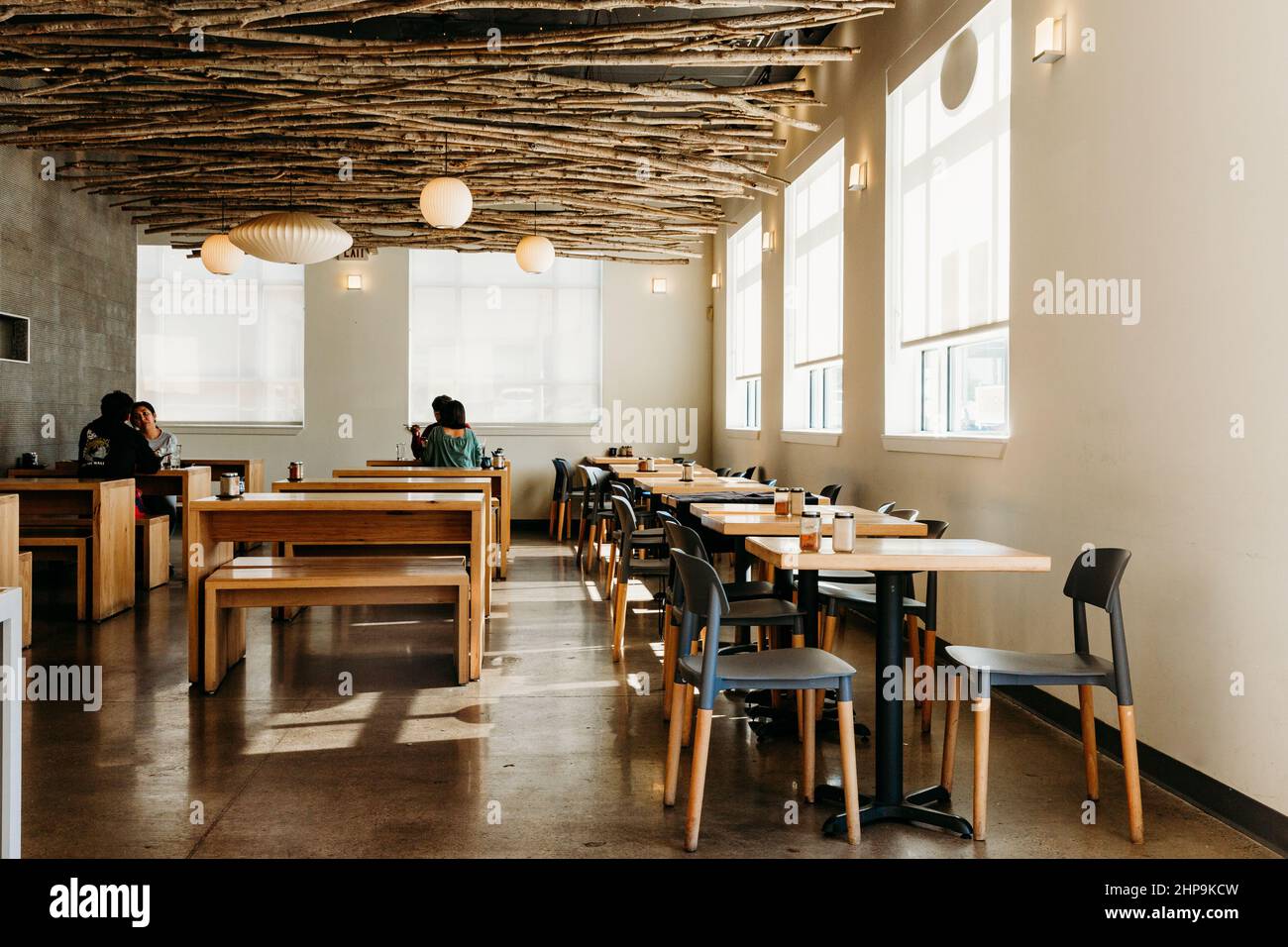 Bowl of tonkatsu ramen on table with wooden spoon in bowl Stock Photo ...