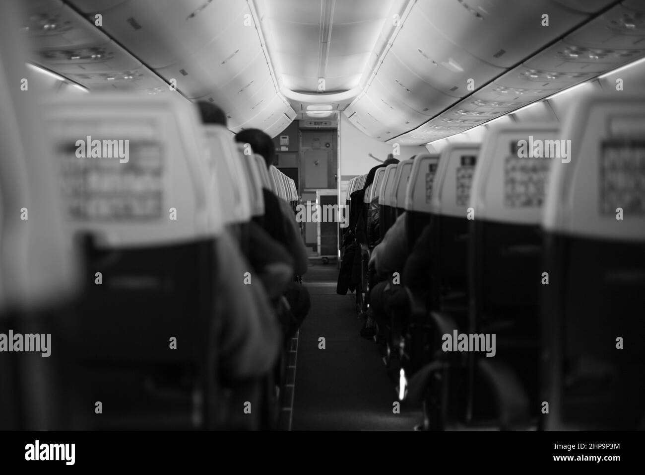 Inside the passenger plane inside the cabin in black and white color ...