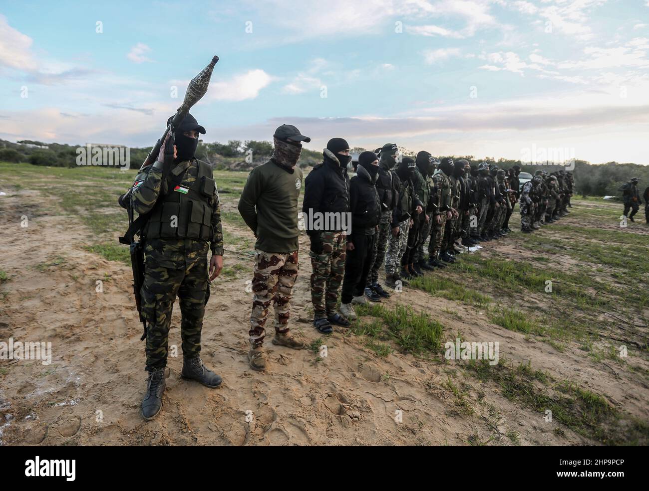 Armed soldiers of the Mujahideen Brigades seen in a straight line on ...