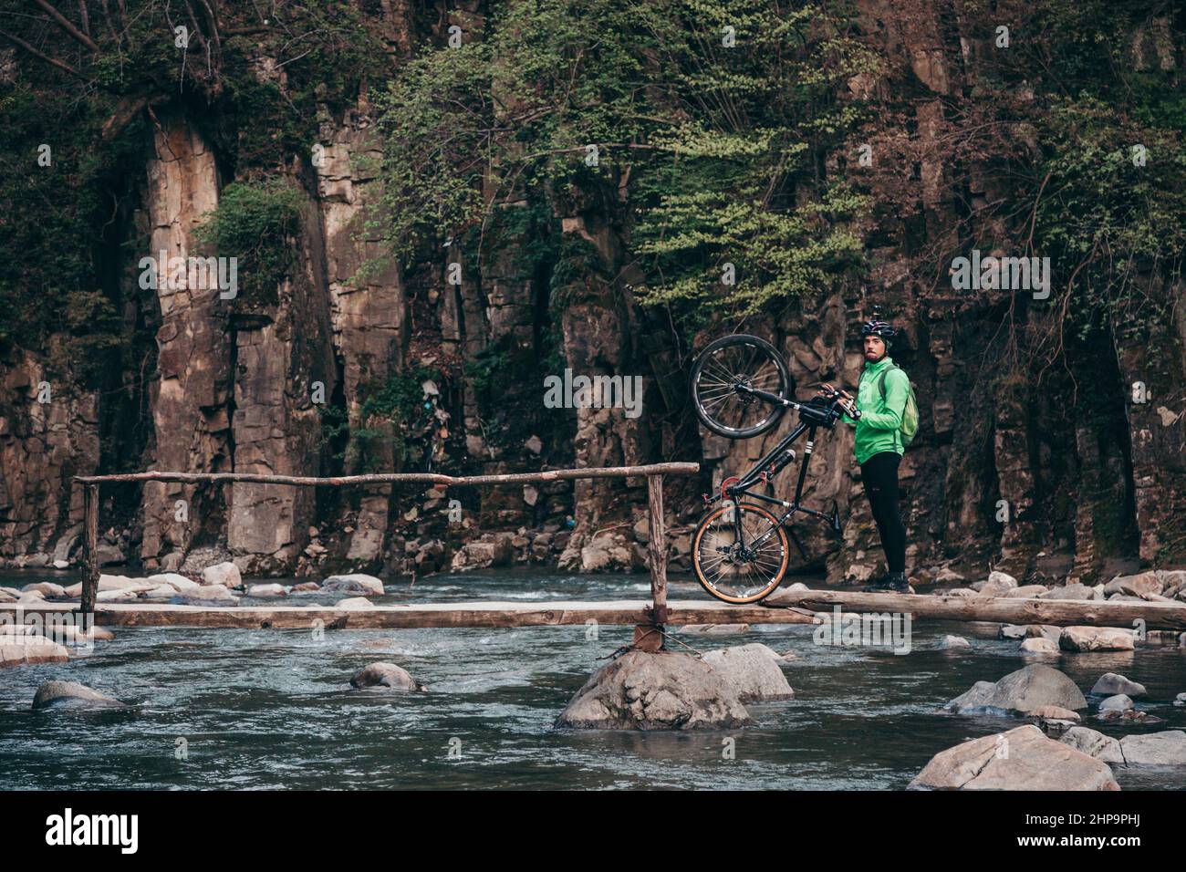 A group of people standing next to a river Stock Photo - Alamy