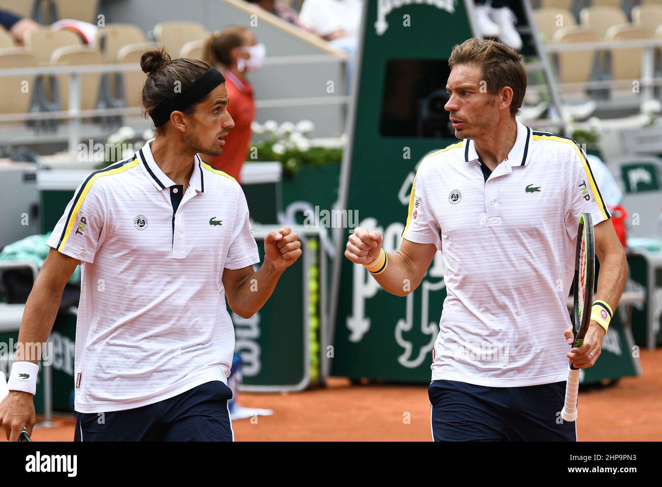 Pierre-Hugues Herbert and Nicolas Mahut of France react during the men ...