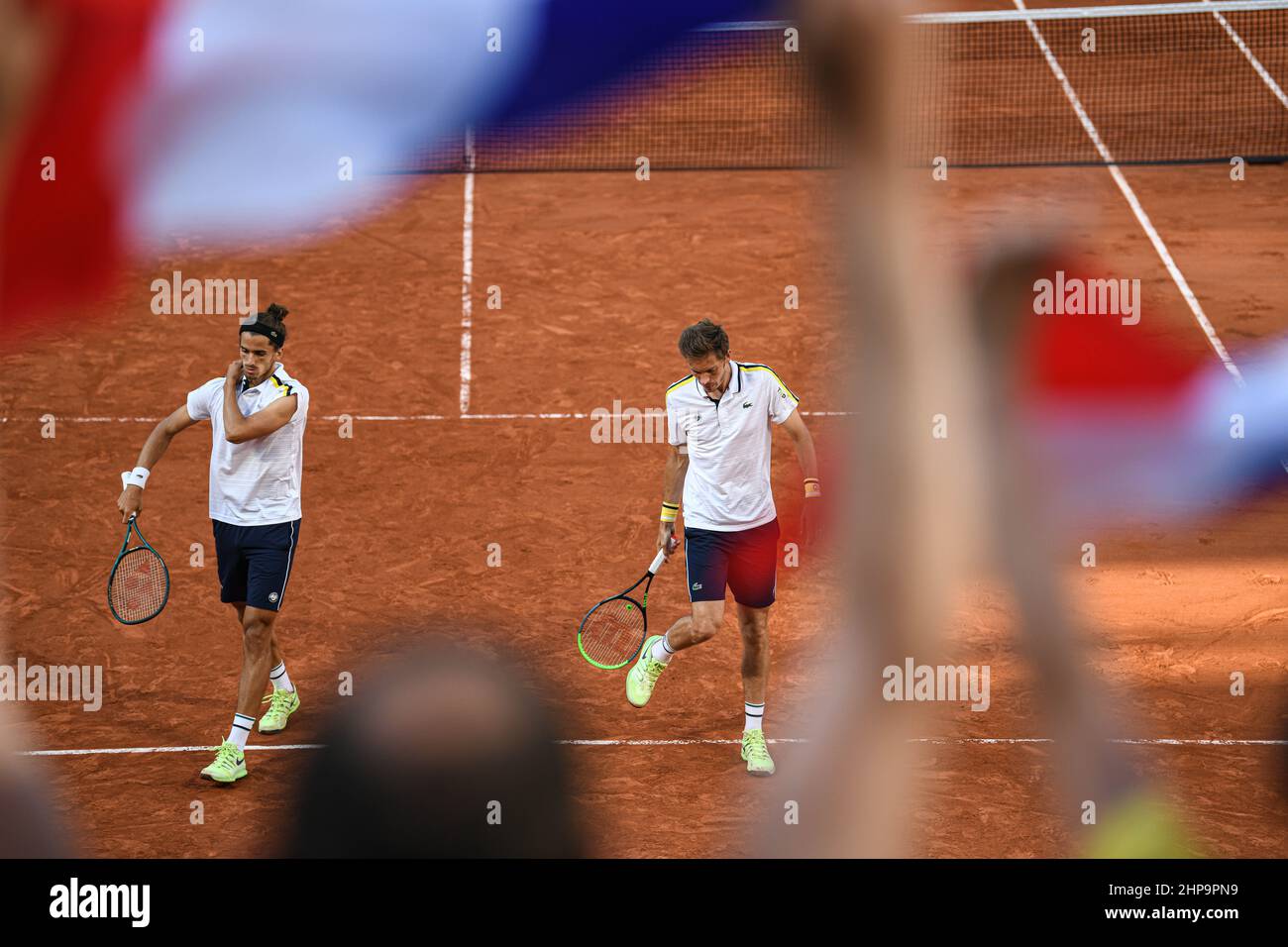 Nicolas Mahut (L) and Pierre-Hugues Herbert of France in action during ...