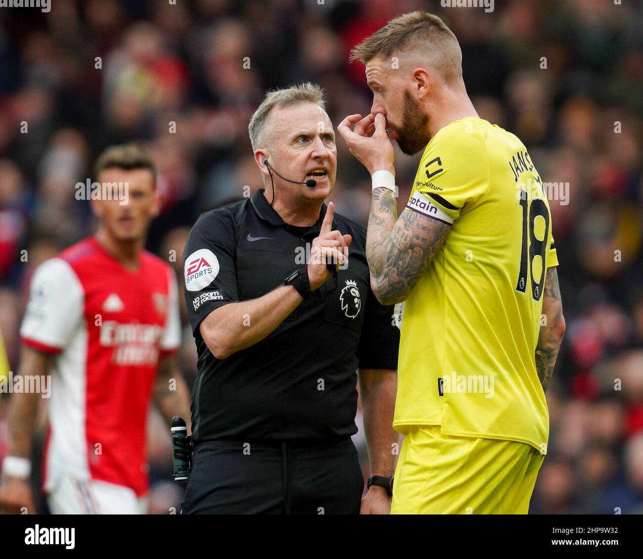 referee Jonathan Moss has a word with Pontus Jansson #18 of Brentford ...