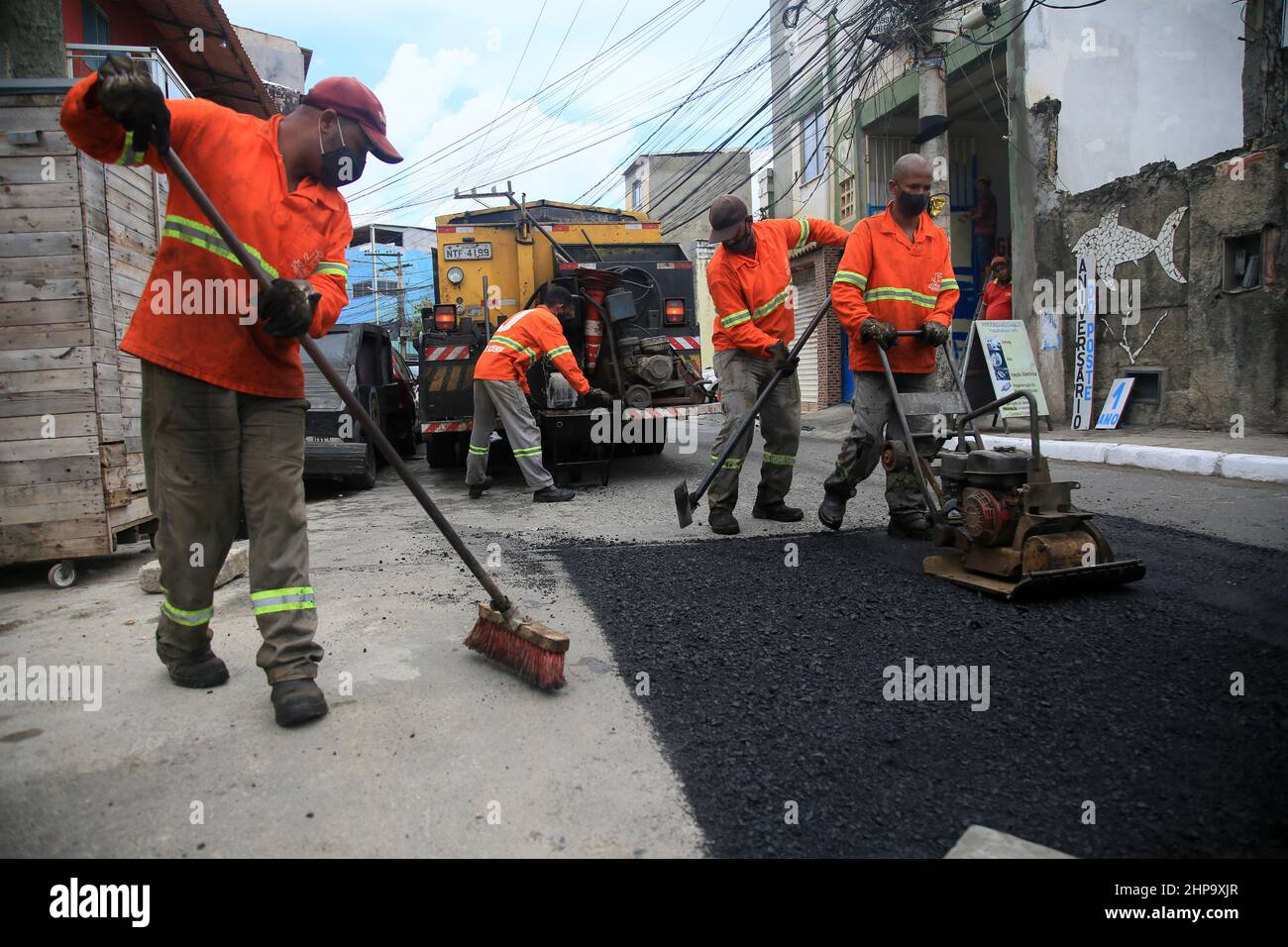 salvador, bahia, brazil - february 18, 2022: Workers repair a hole in ...