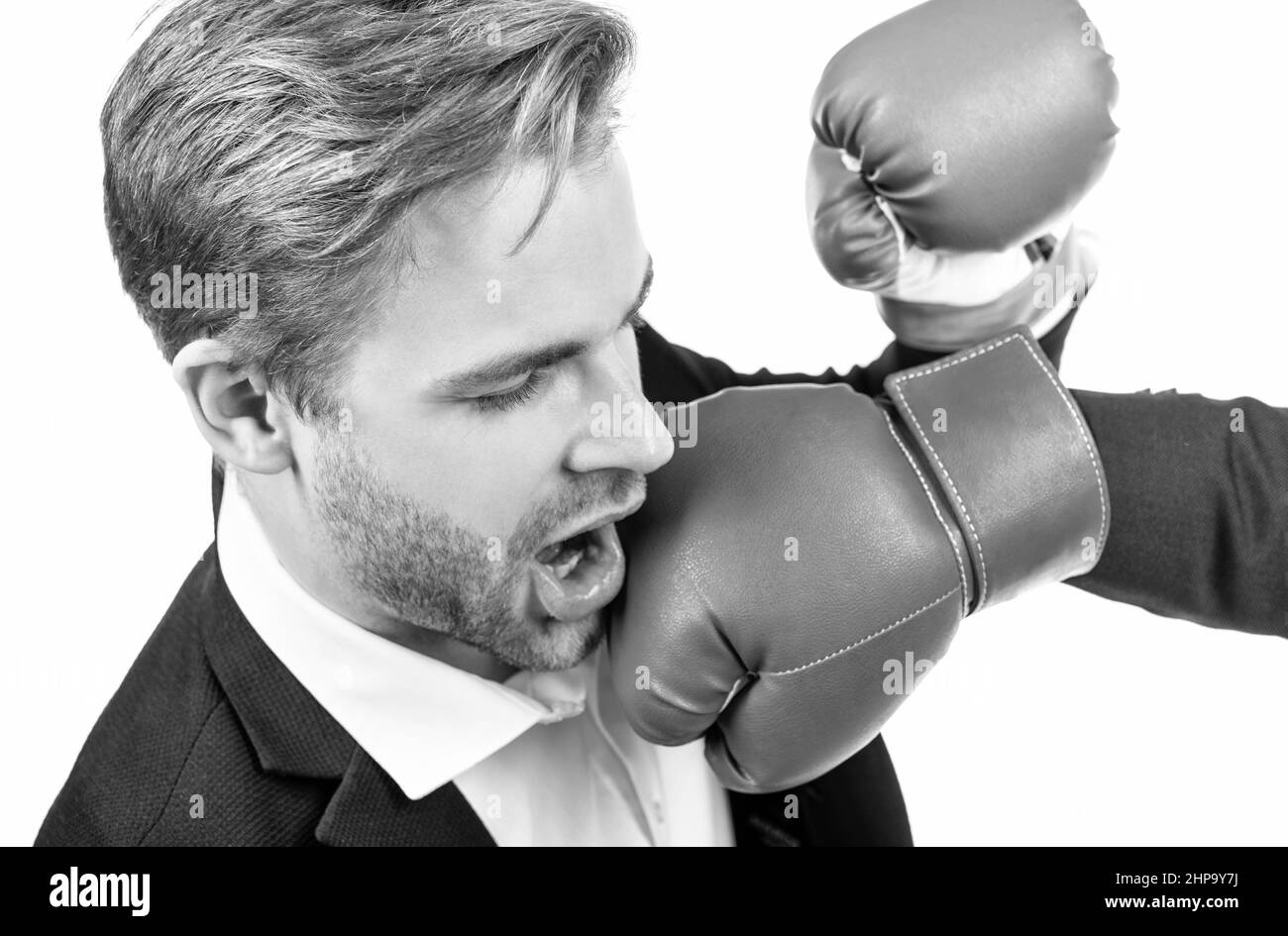 Businessman face punch Black and White Stock Photos & Images - Alamy