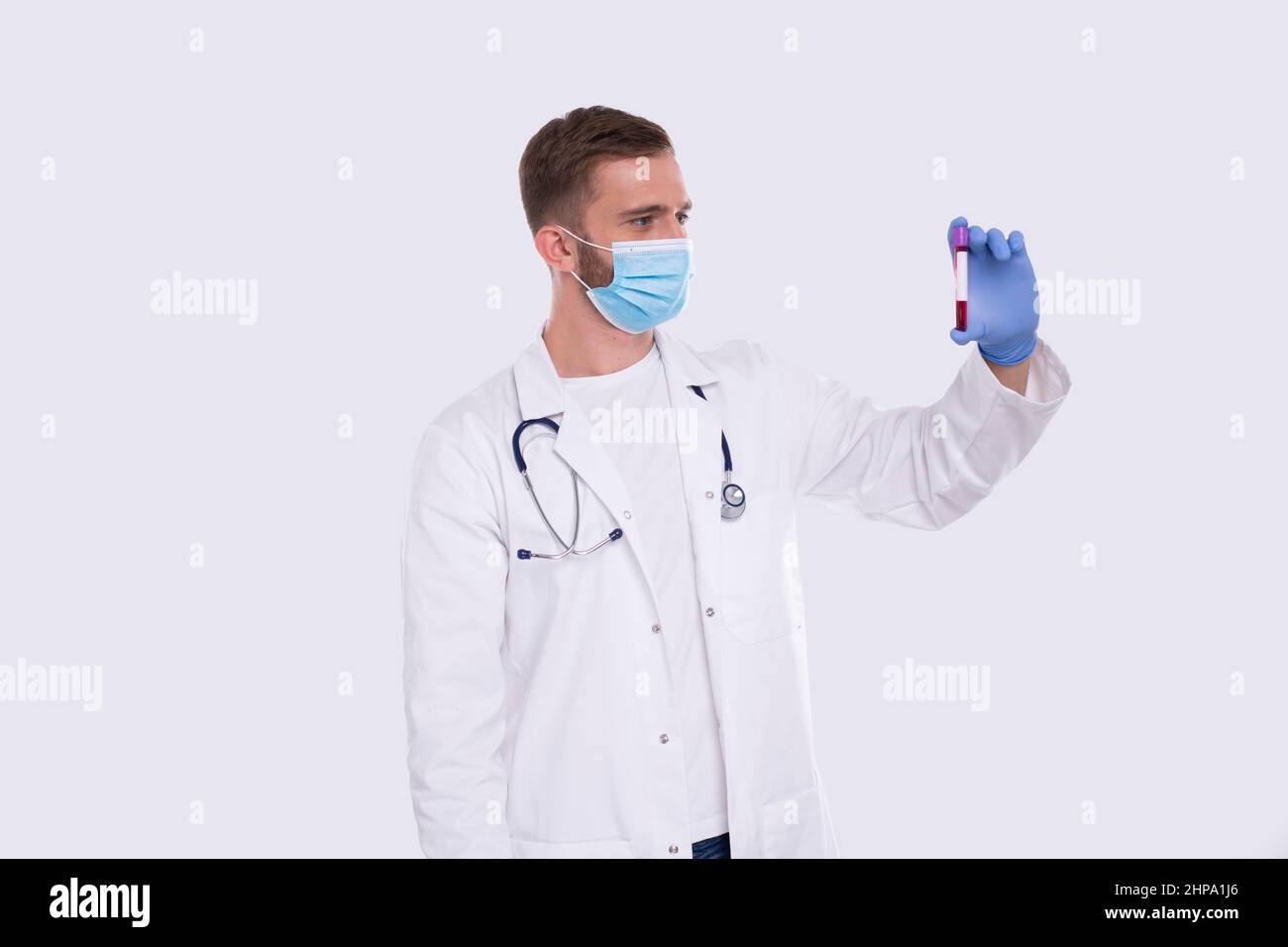 Man Doctor Holding Blood Tube Analysis Wearing Medical Mask And Gloves ...