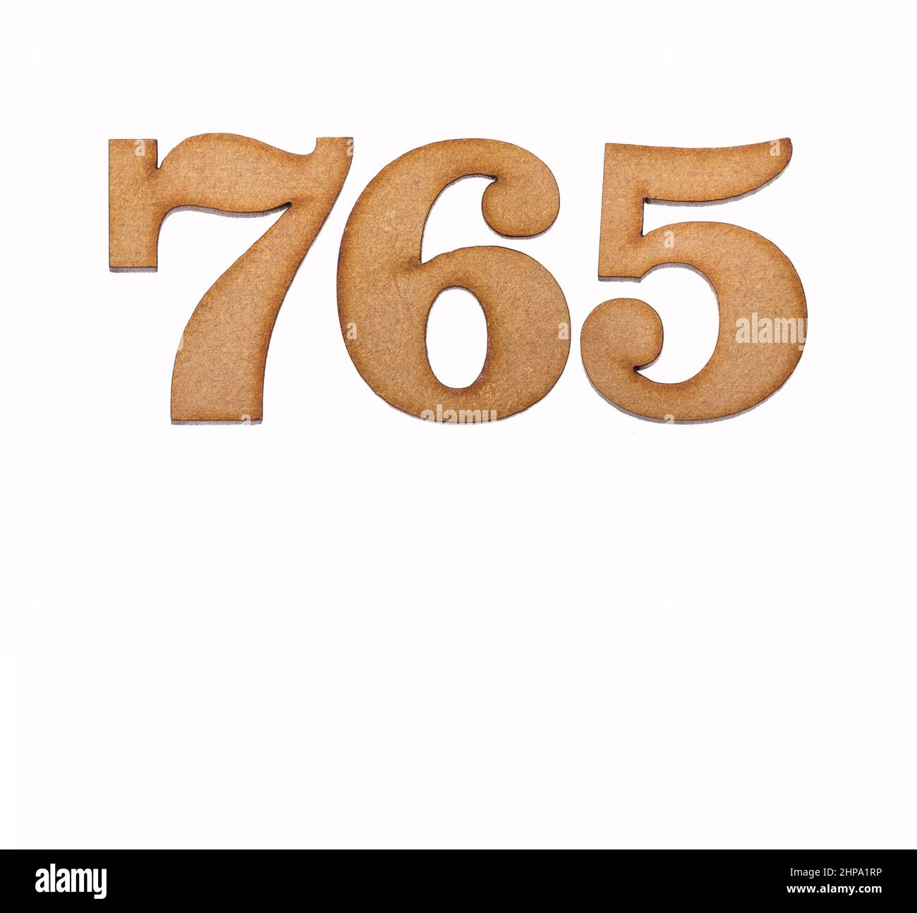 Number 765 in wood, isolated on white background Stock Photo - Alamy