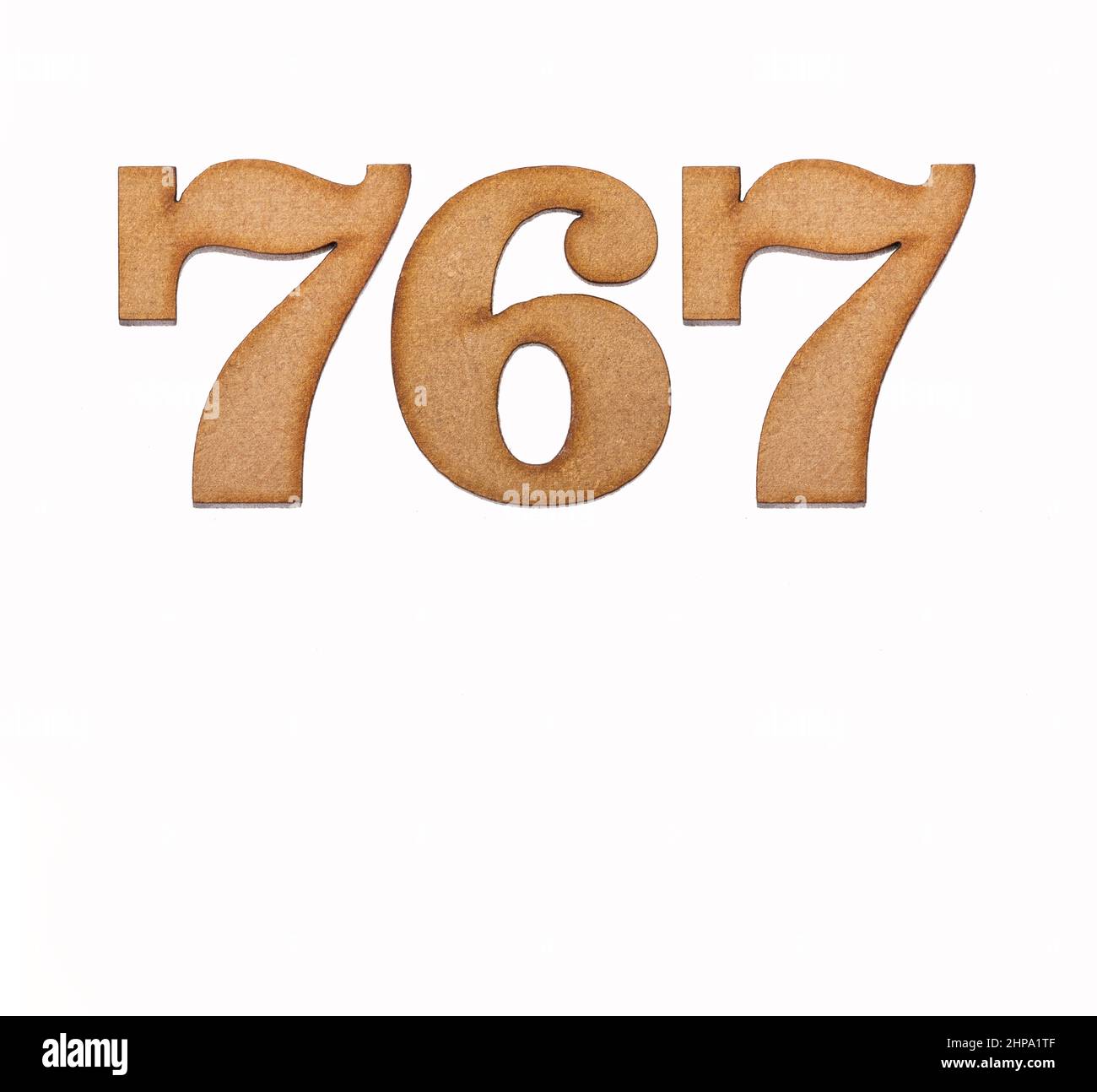 Number 767 in wood, isolated on white background Stock Photo - Alamy