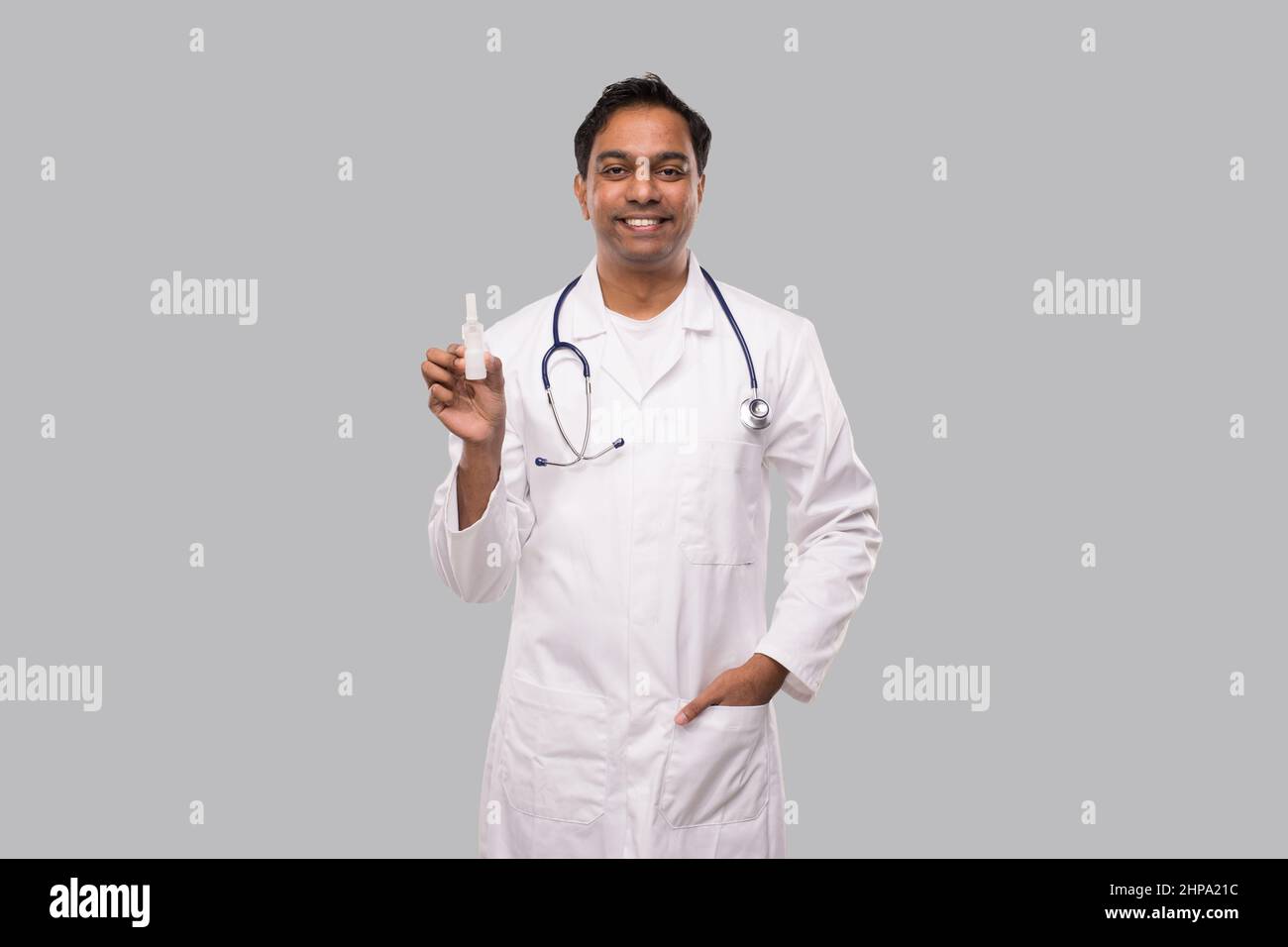 Doctor Holding Nose Spray Isolated. Indian Man Doctor with Nasal Spray ...