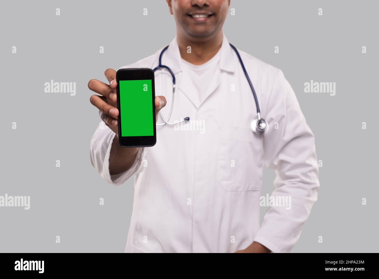 Doctor Holding Phone. Indian Man Doctor Technology Medicine at Home ...