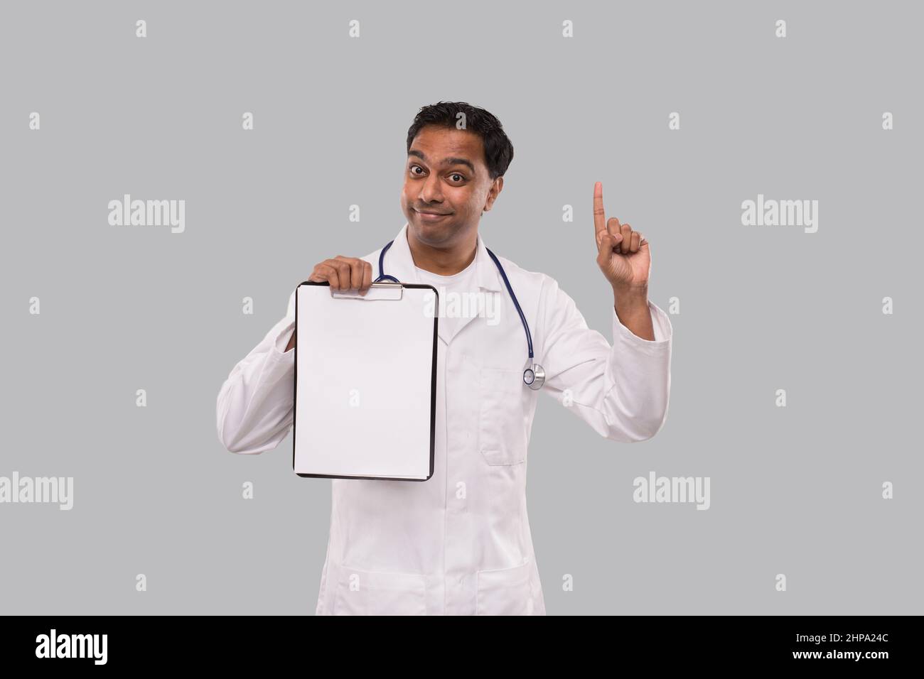 Doctor Pointing Up Clipboard Isolated. Indian Man Doctor Blank ...
