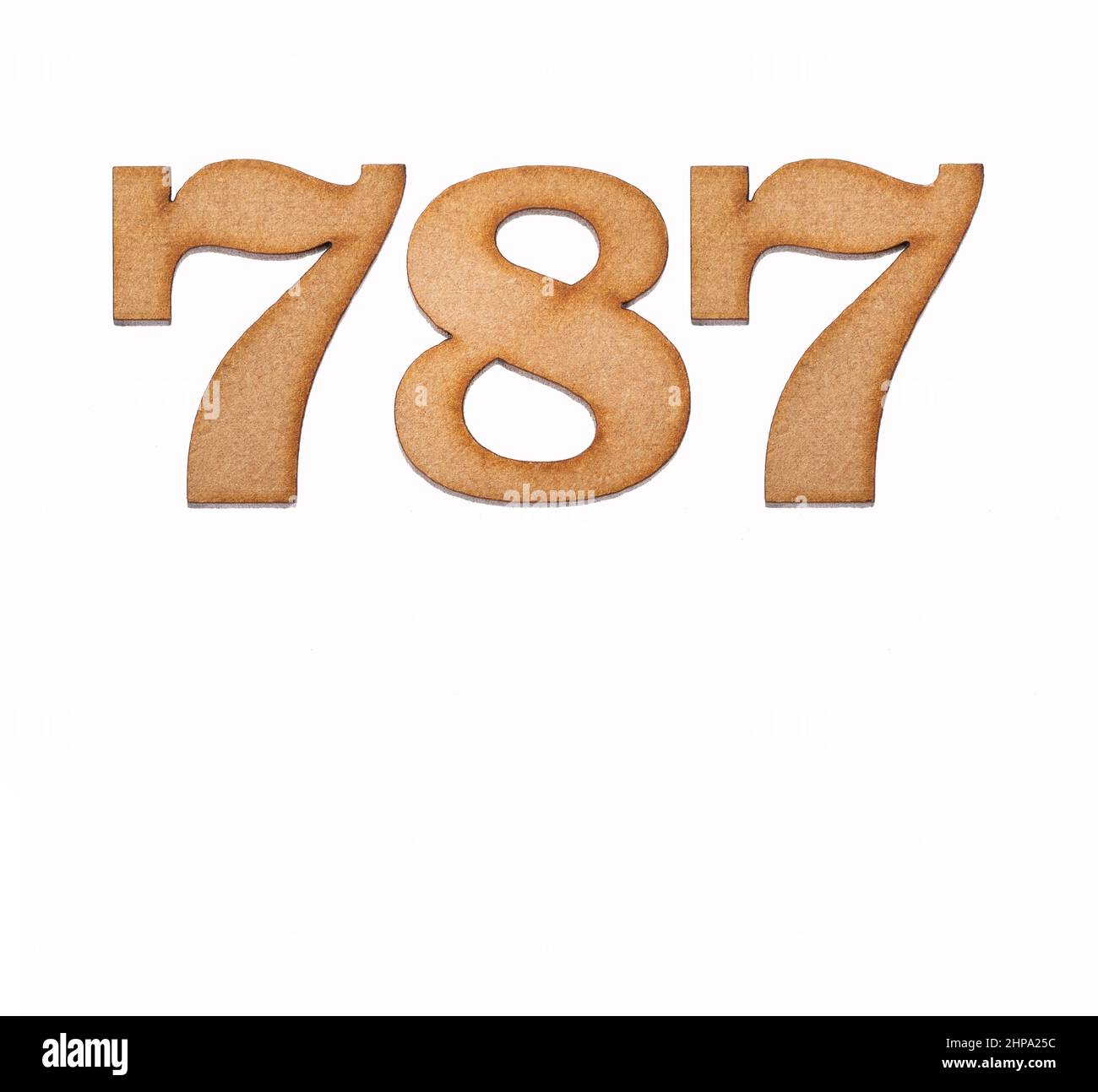 Number 787 in wood, isolated on white background Stock Photo - Alamy