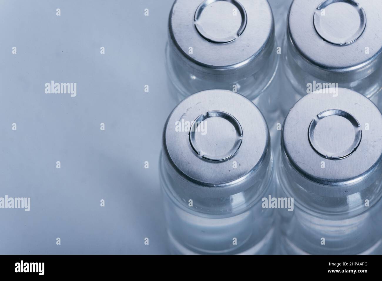 Glass medical ampoule vial for injection. Medicine is dry white drug ...