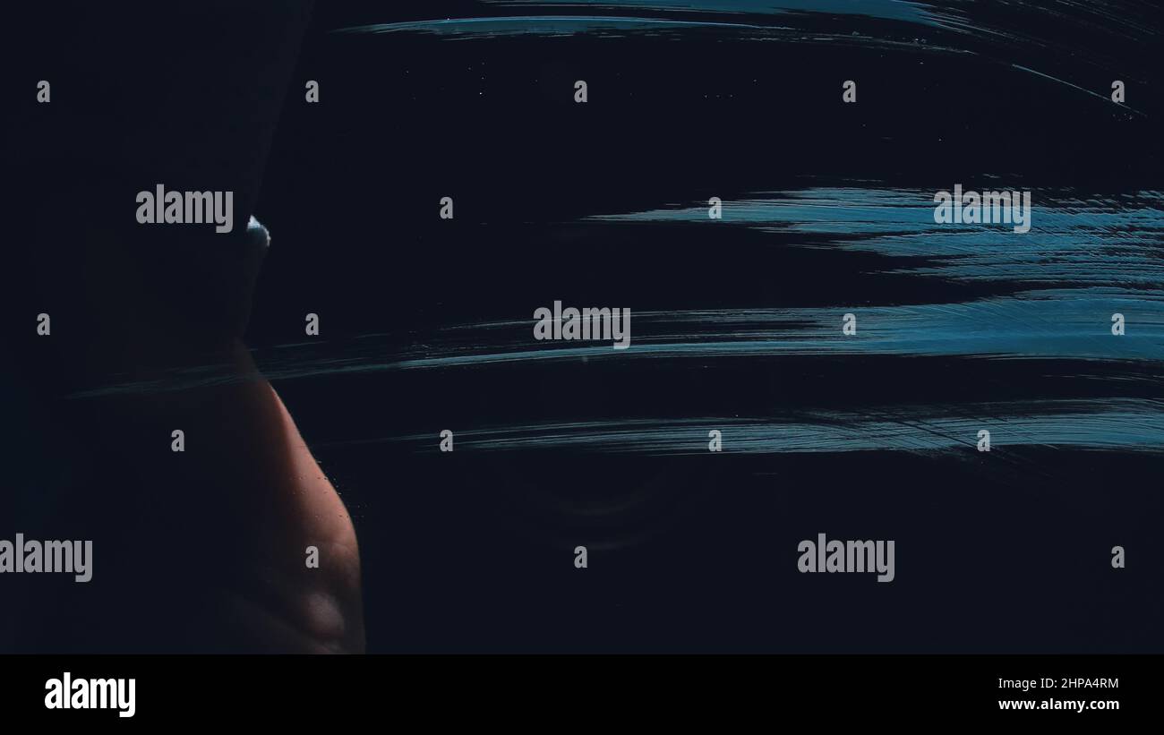 The artist draw on glass. Back view. Craftsman decorator use large ...