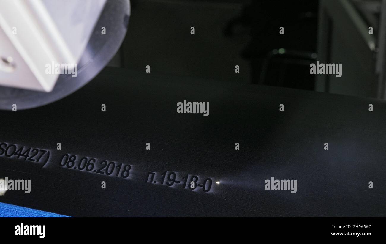 Laser Marking Machine Engraving. Manufacture of plastic water pipes of ...