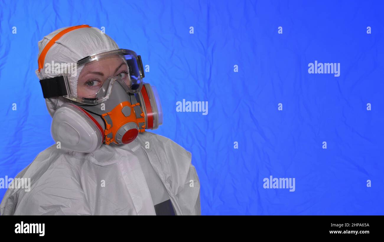 Scientist virologist in respirator. Slow motion. Woman close up look ...