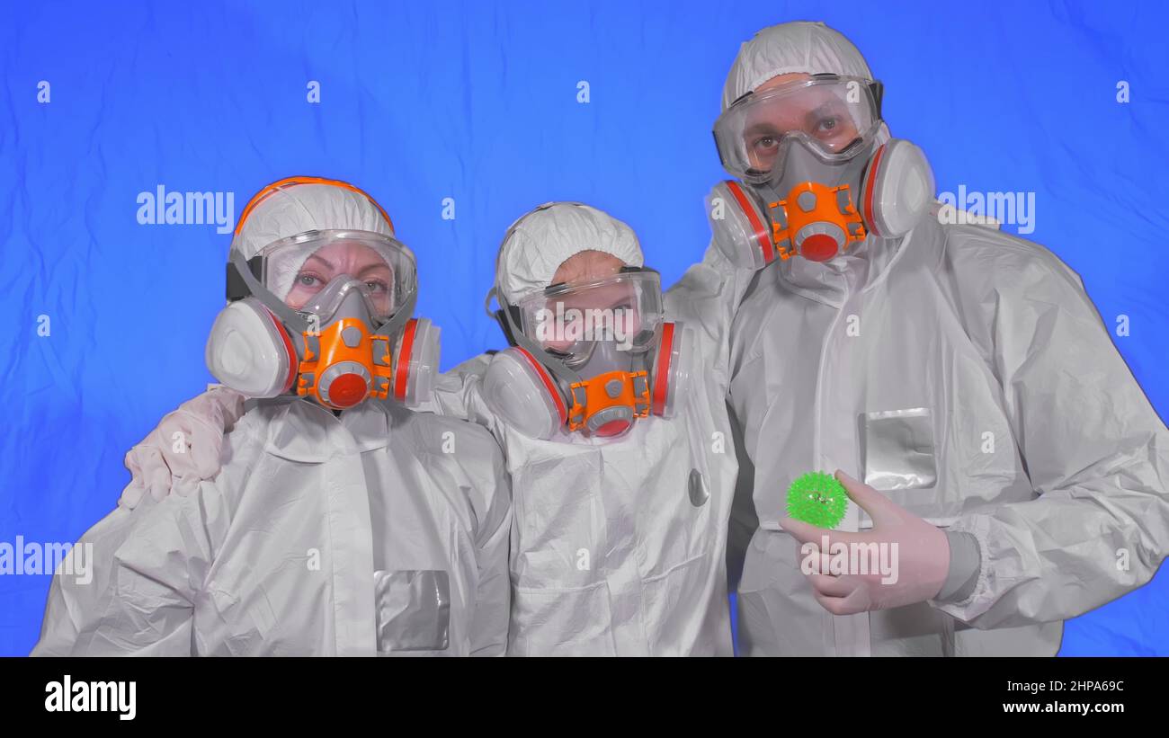 Family of doctors scientists health worker in respirator. Mom, dad and ...