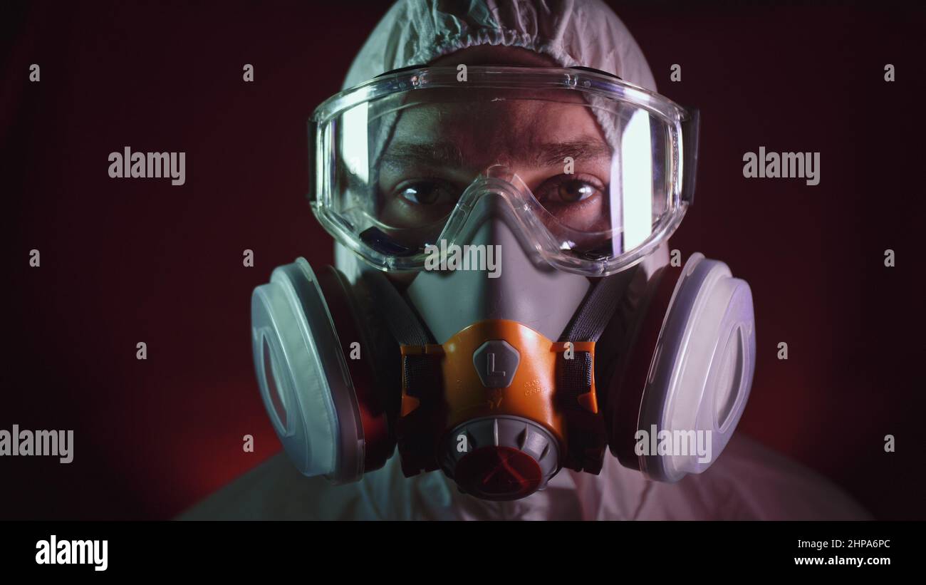 Man in protective costume suit, gas protect medical antibacterial ...