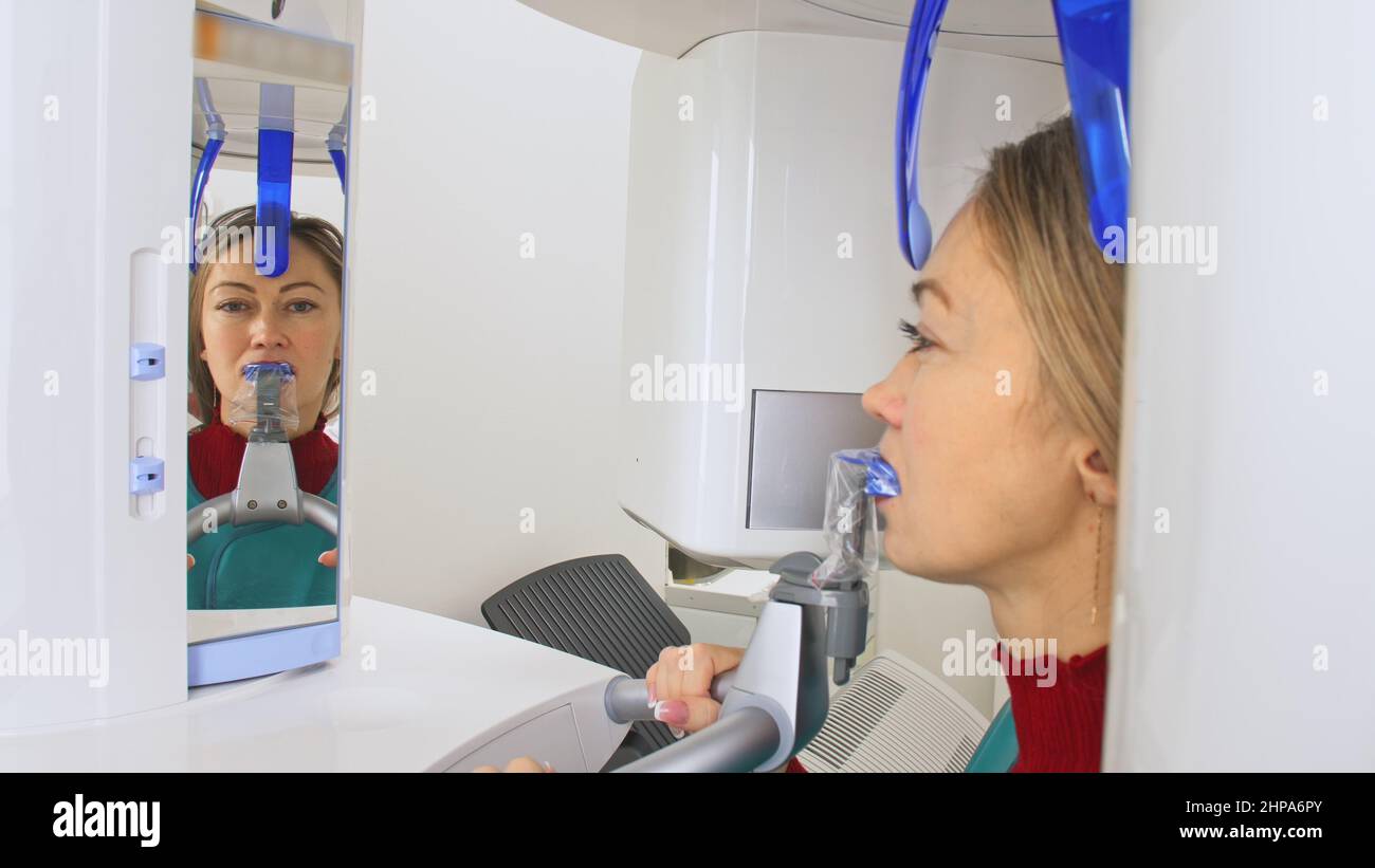 Doctor to take a image 3d scanner tomography of teeth and jaw in modern ...