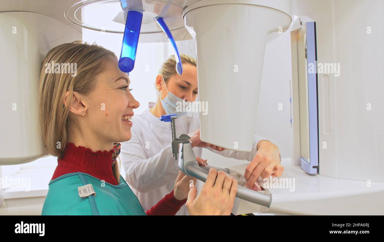 Doctor to take a image 3d scanner tomography of teeth and jaw in modern ...