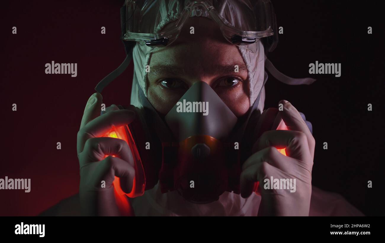 Man in protective costume suit, gas protect medical antibacterial ...