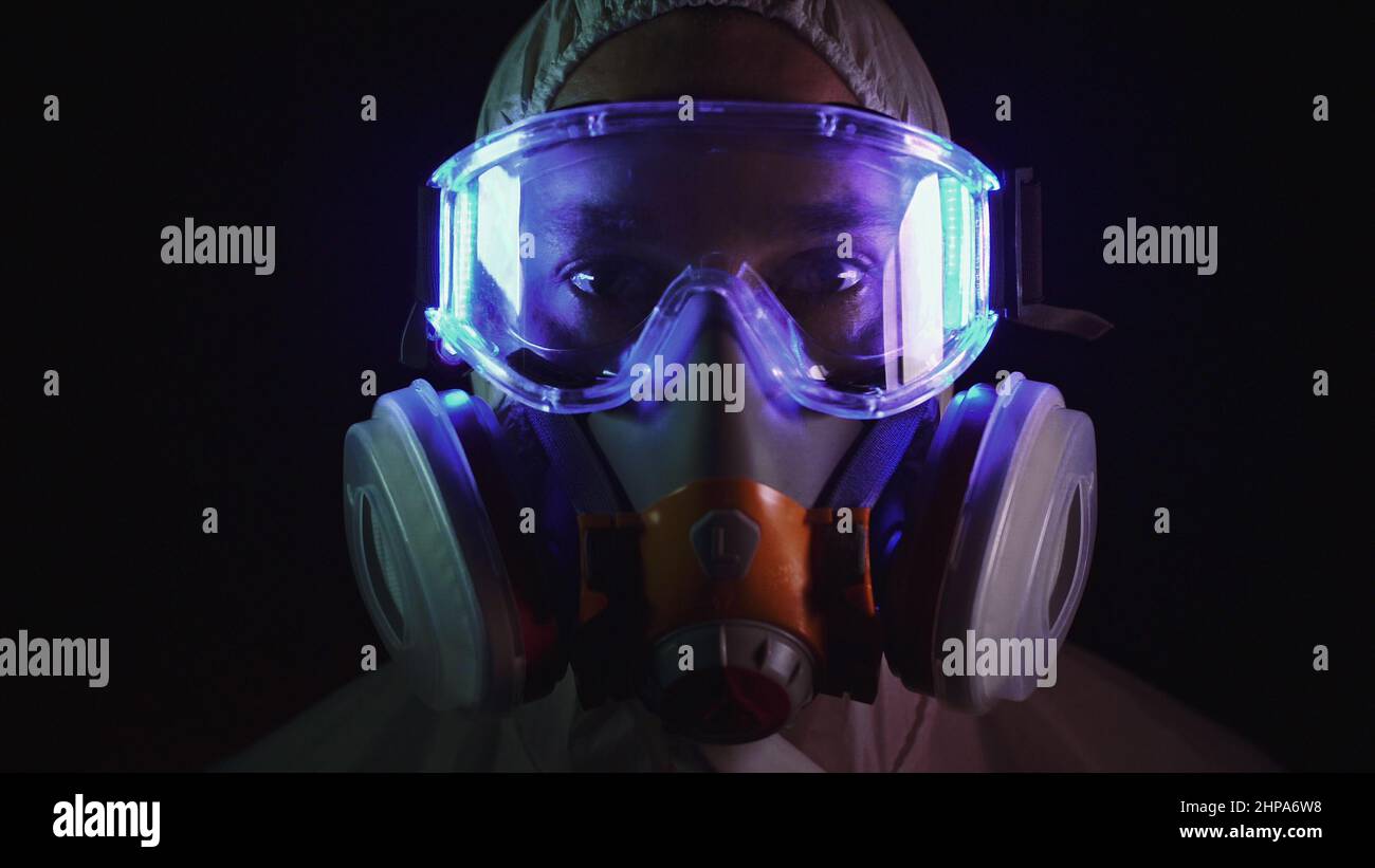 Man in protective costume suit, gas protect medical antibacterial ...