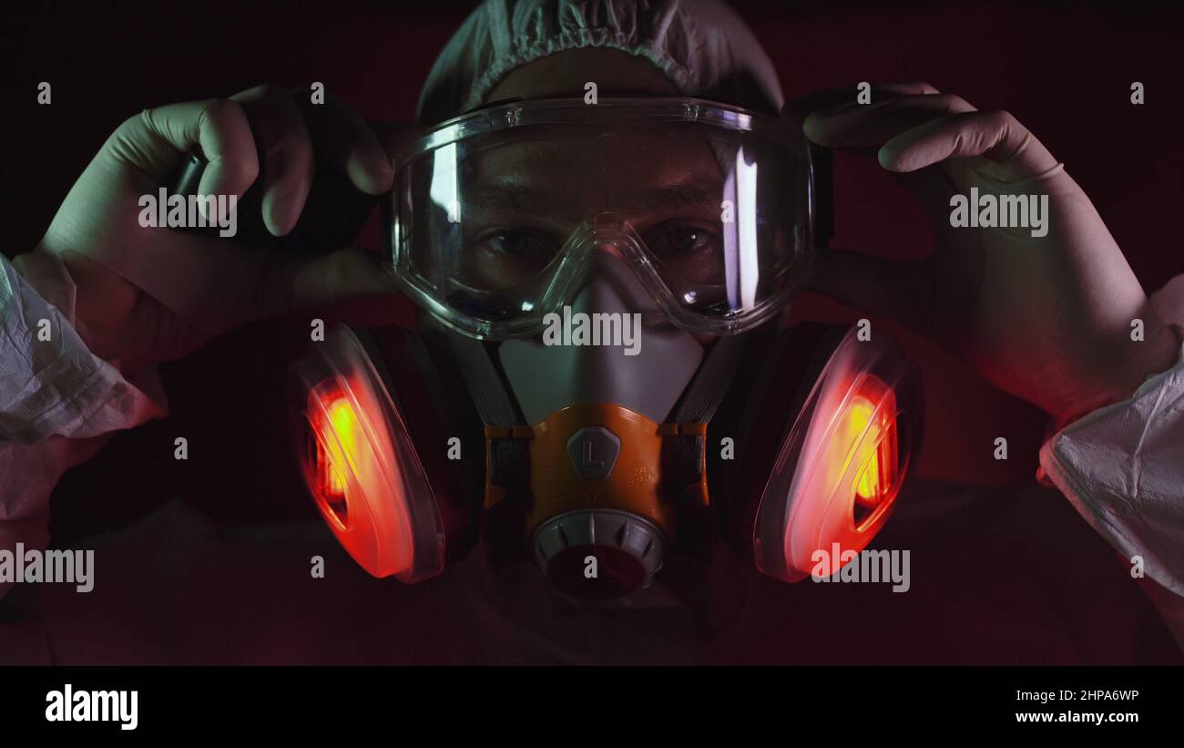 Man in protective costume suit, gas protect medical antibacterial ...