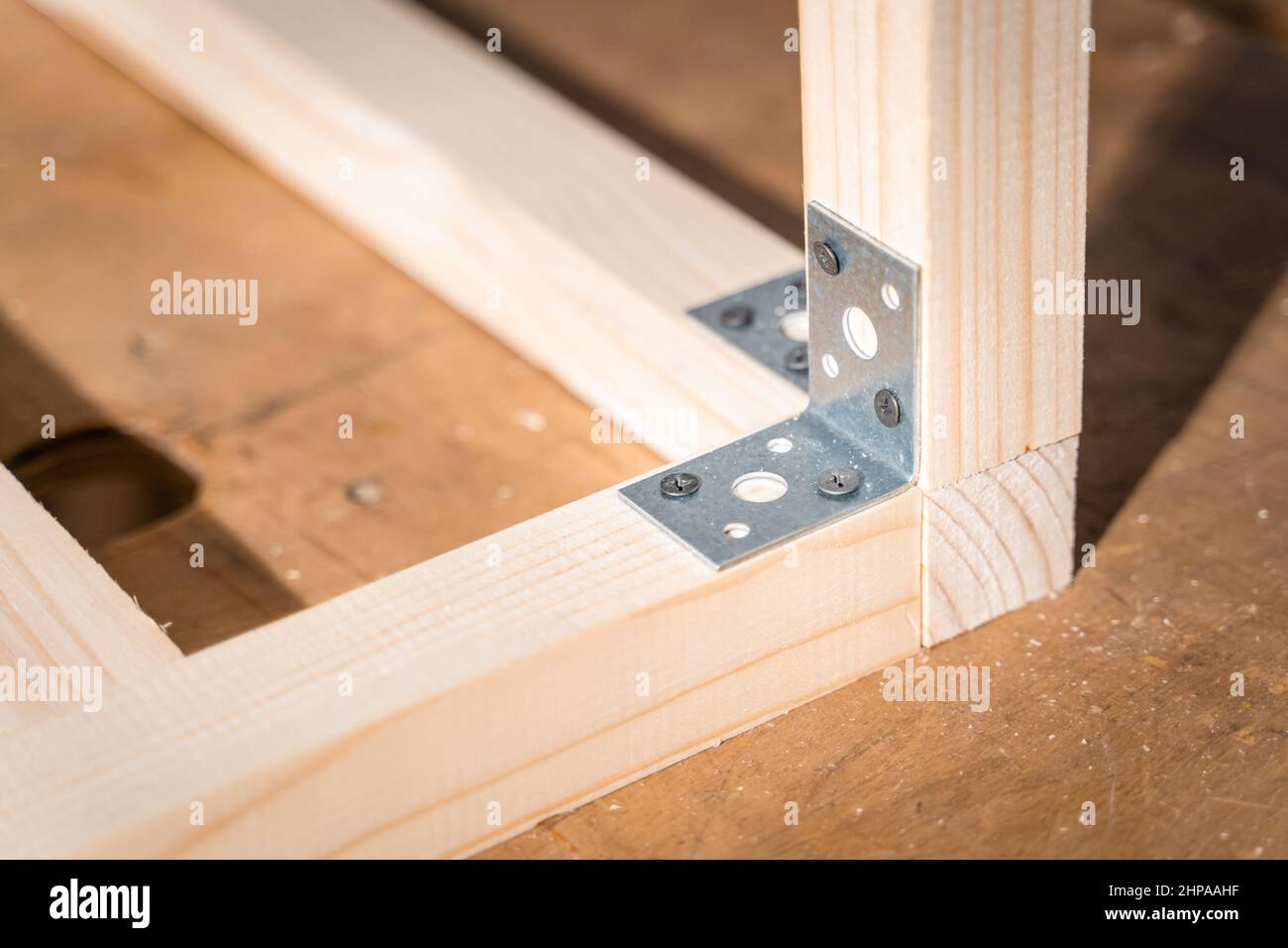 Corner connection of wooden bars with iron corners and black self ...