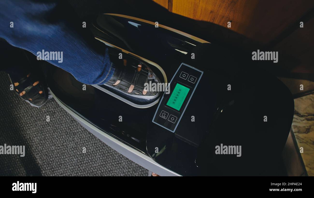 Automatic Thermal Shrinkable Shoe Cover Laminating Machine. Close up ...