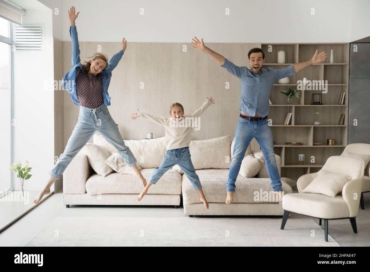 Excited happy active family having fun at home Stock Photo - Alamy