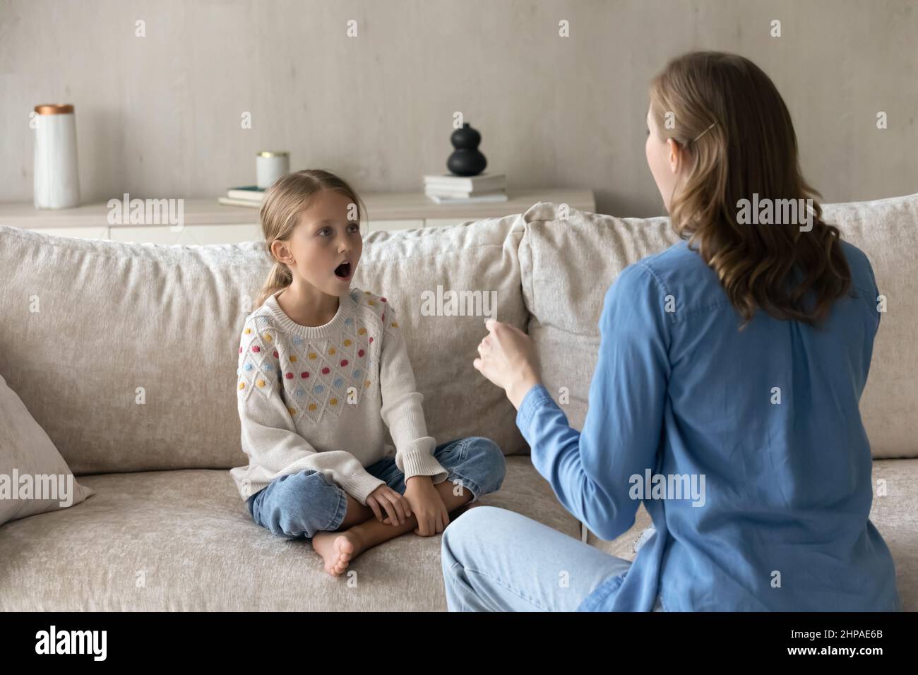 Singing teacher training student girl kid at home Stock Photo - Alamy