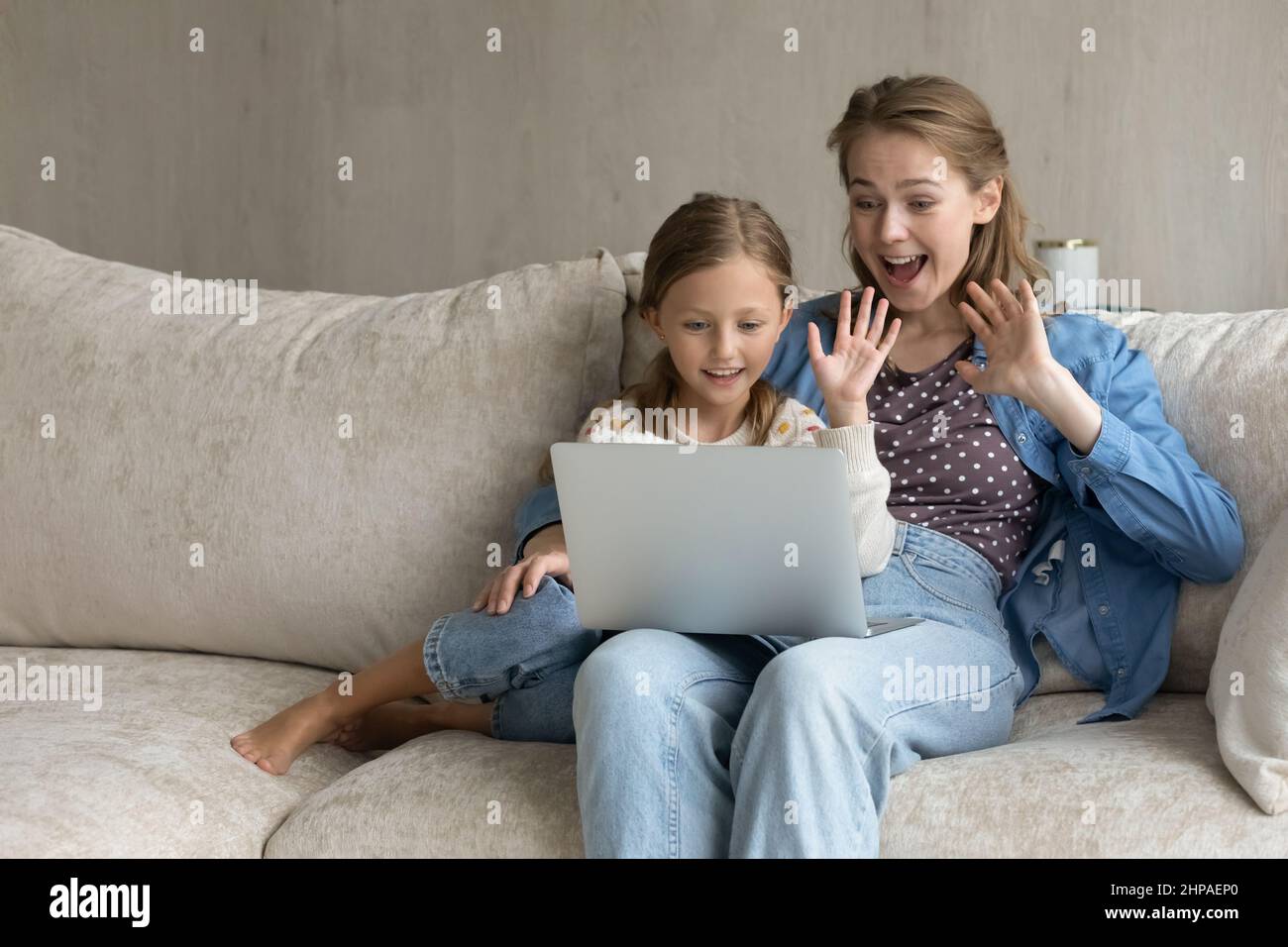 Happy excited mom and daughter kid talking on video call Stock Photo - Alamy