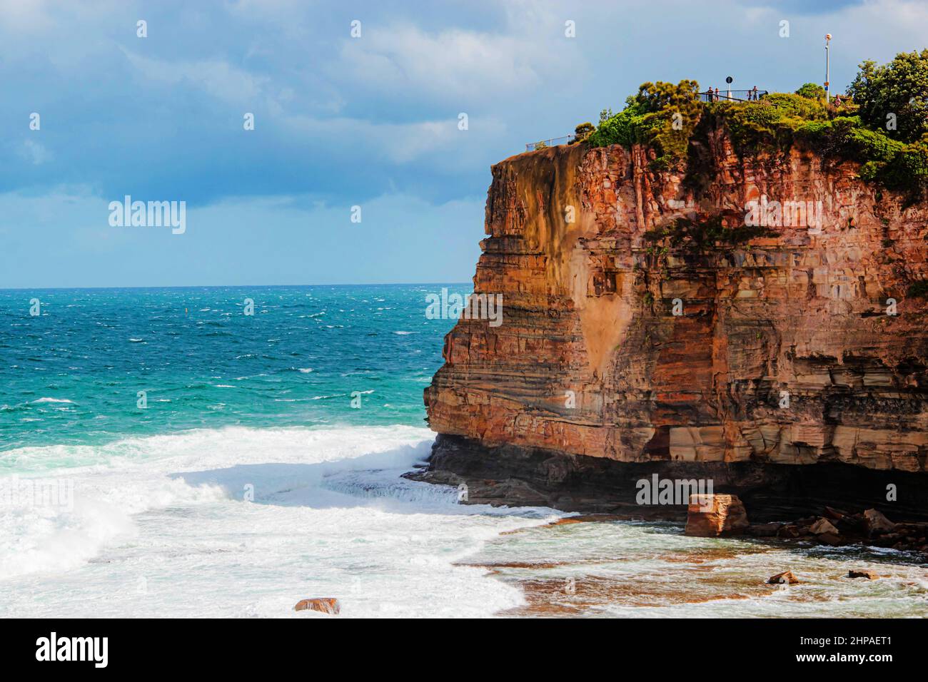 Beautiful orange cliff on a seashore Stock Photo - Alamy