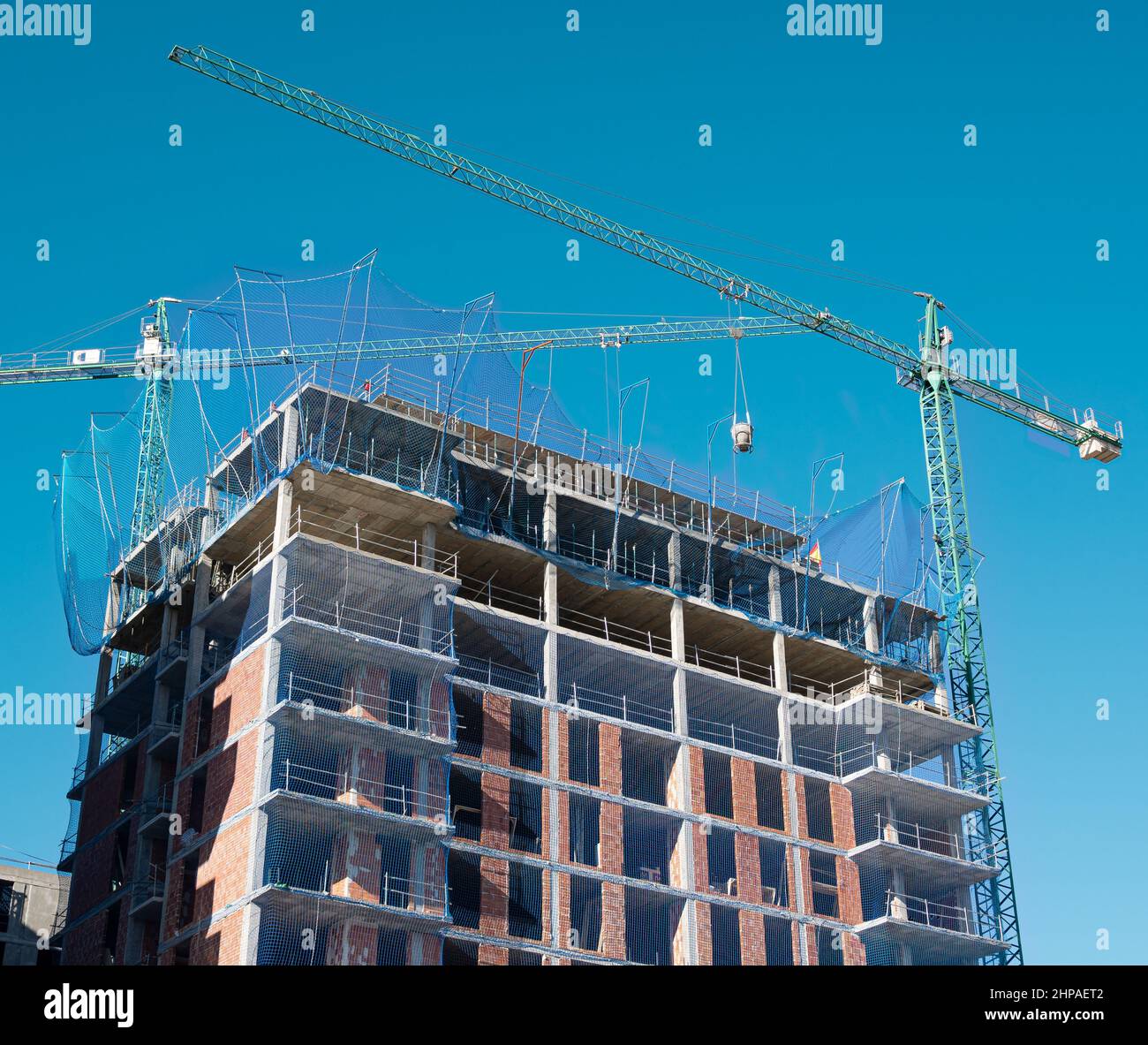 Low angle of a residential building under construction in the city with ...