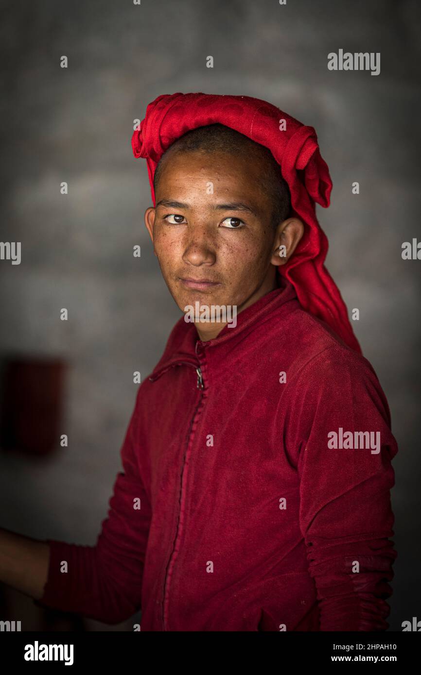 Young lama outside key monastery, Spiti Valley, Himachal Pradesh, India ...