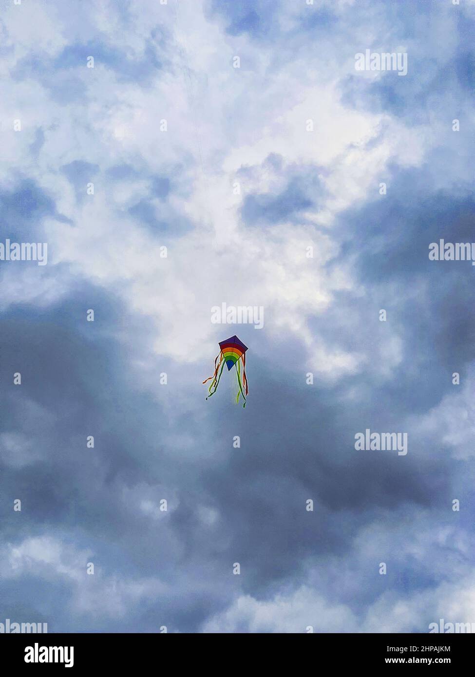 Shot of a rainbow kite in the sky Stock Photo - Alamy