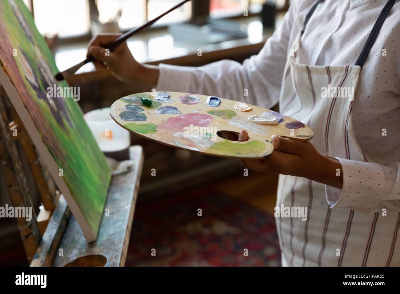 Close up cropped young male artist painting on canvas Stock Photo - Alamy