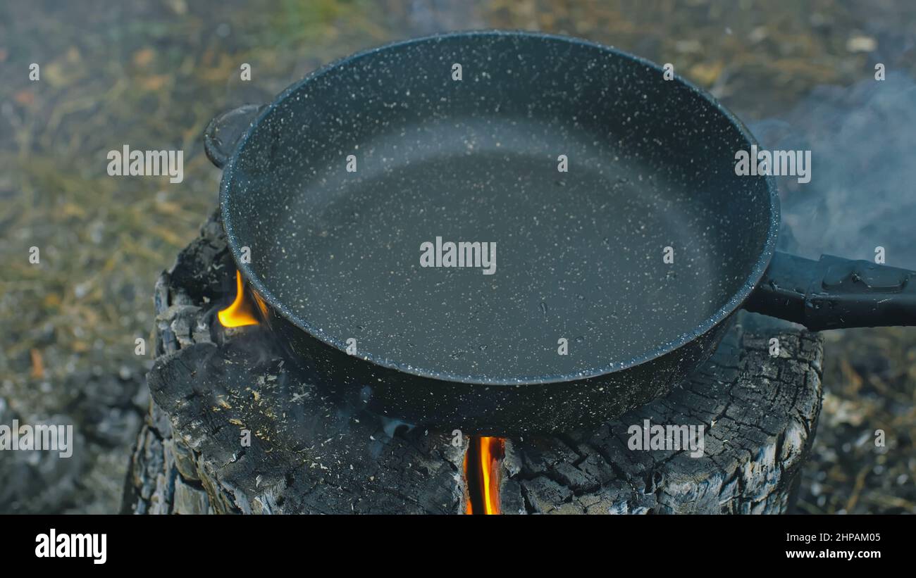 Swedish or finnish log candle. Fire burning from inside the wooden log ...
