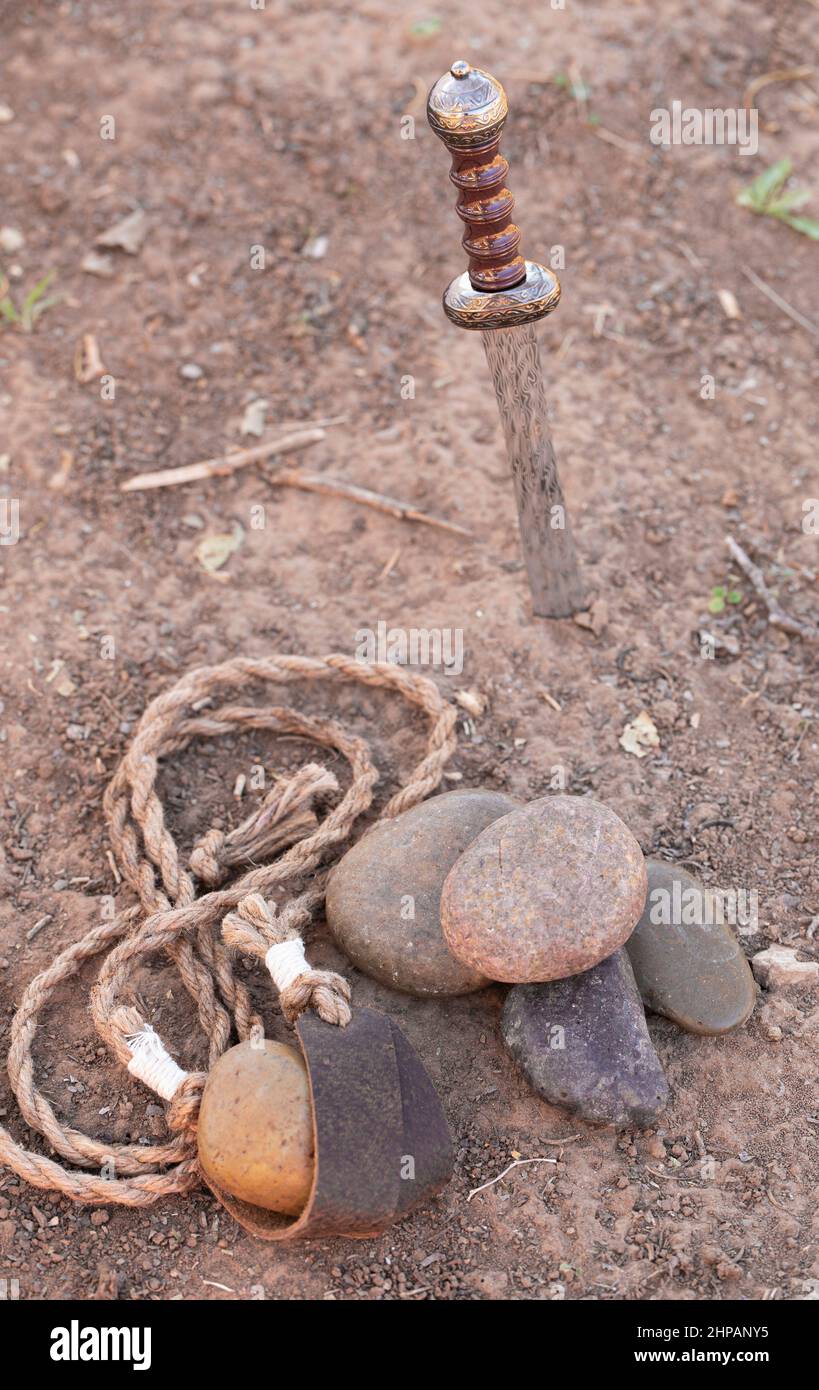 Sling of David with Five Smooth Stones and Goliaths Sword in the Dirt ...