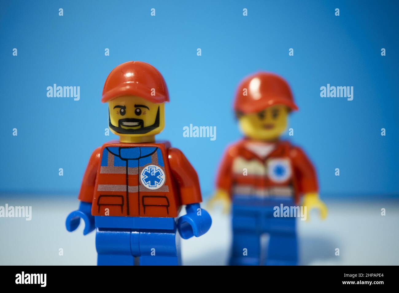 Lego doctor figures in a blue background Stock Photo - Alamy