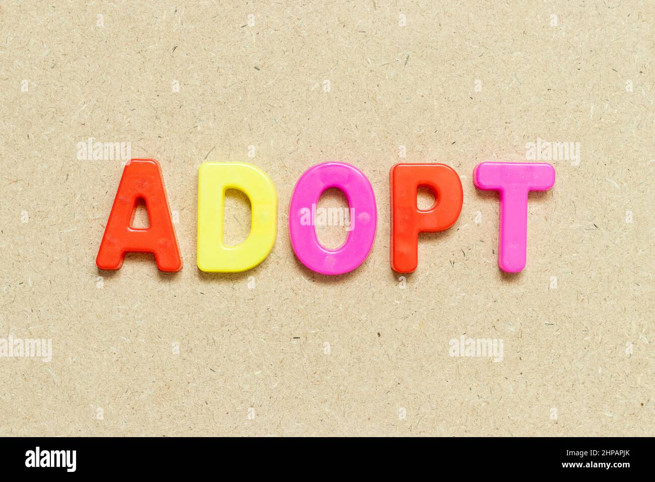 Color alphabet letter with word adopt on wood background Stock Photo ...