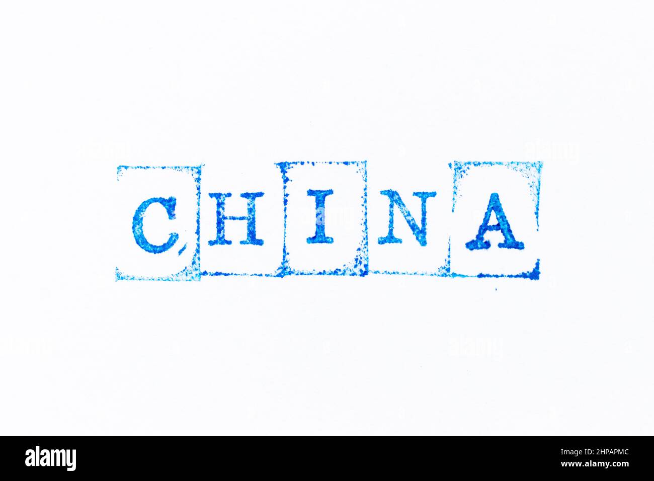 Blue color ink rubber stamp in word china on white paper background ...