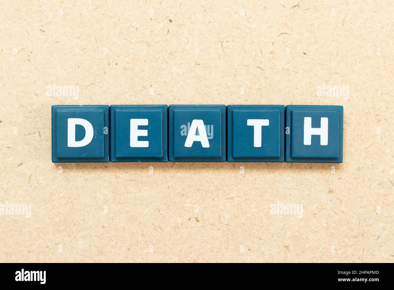 Tile alphabet letter in word death on wood background Stock Photo - Alamy