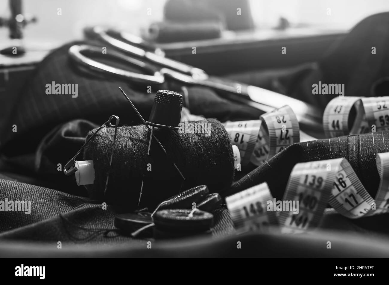 Retro tools for cutting and sewing. Needle with thread, thimble, sewing ...