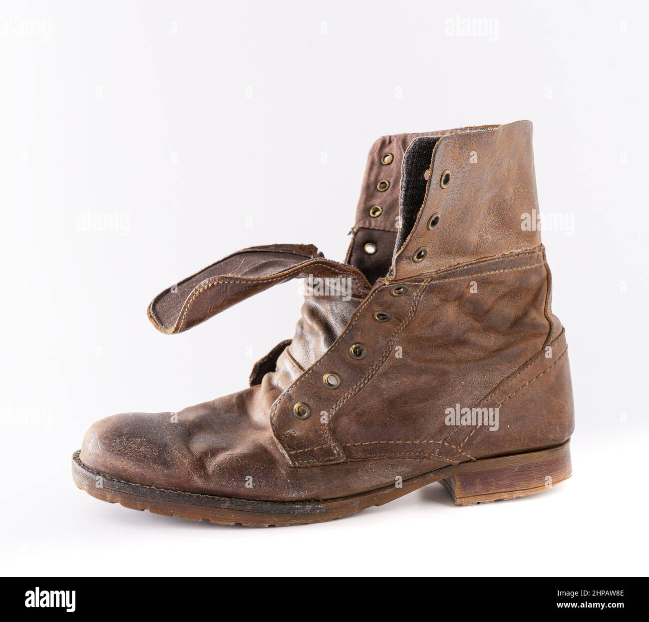 Old shoes on a white background. Leather brown shoe. Worn shoes. Boots ...