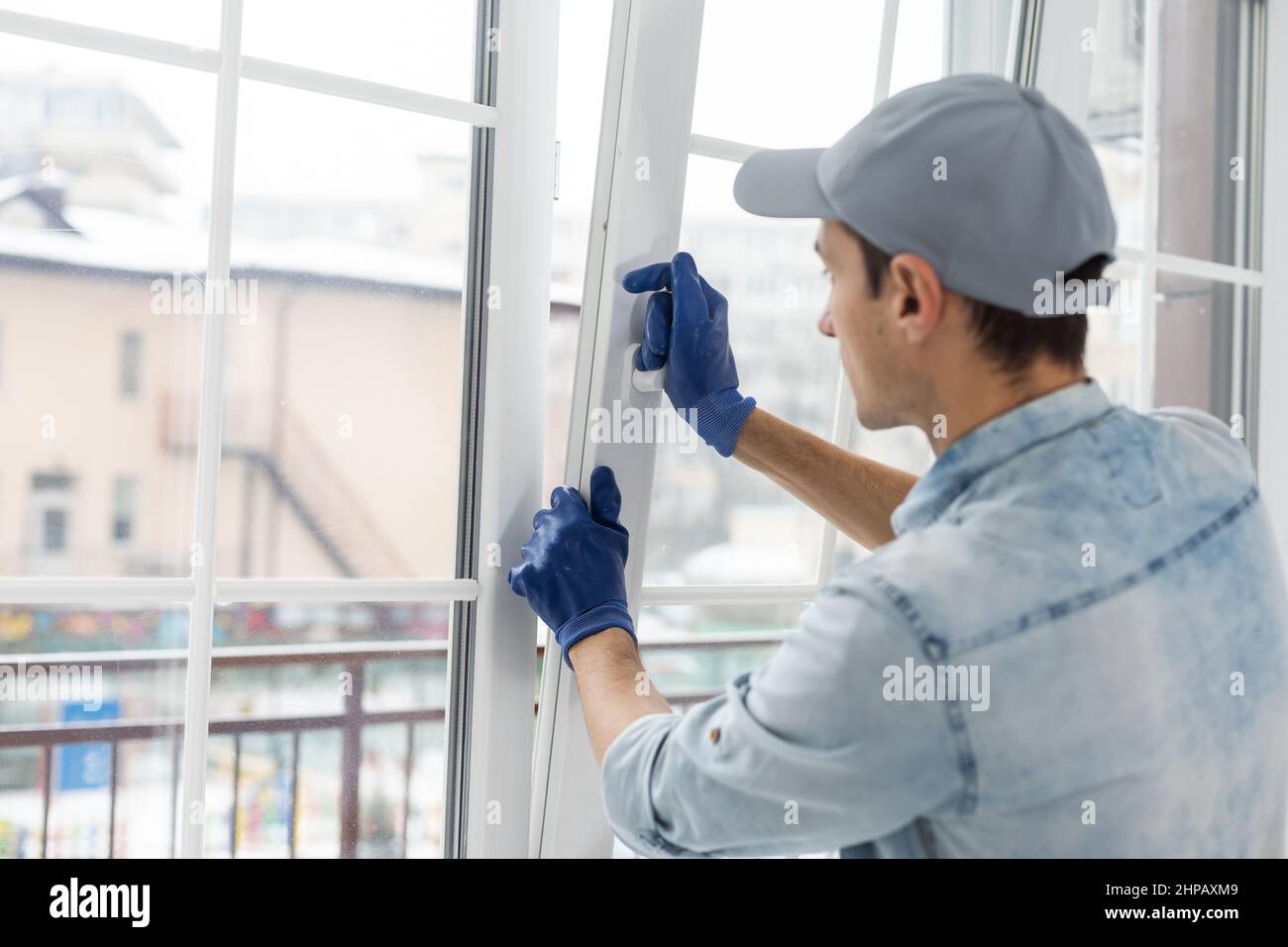 The worker installing and checking window in the house Stock Photo - Alamy