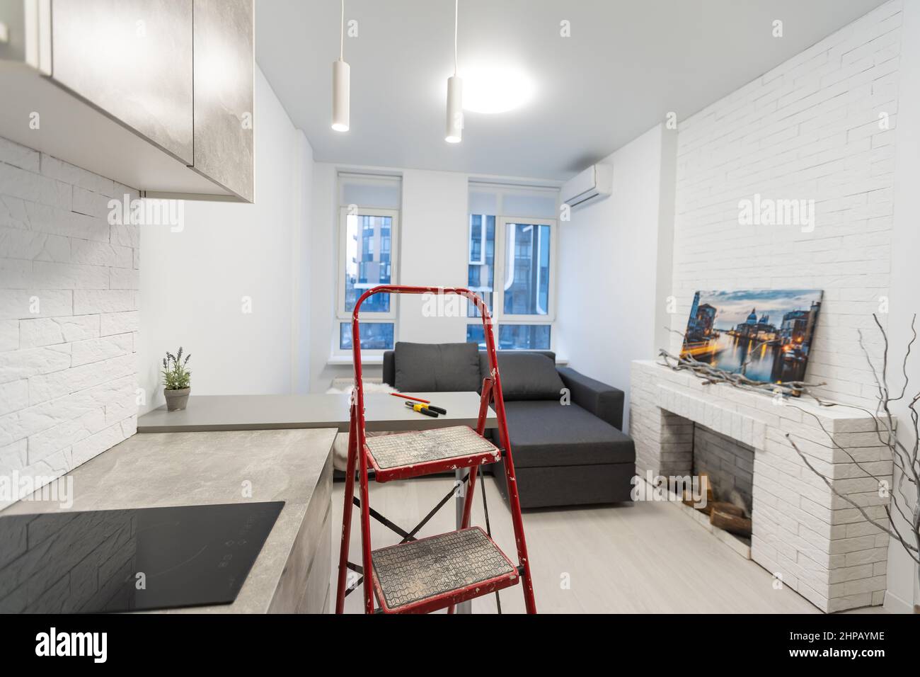 Installing New furniture In Modern Kitchen, ladder Stock Photo - Alamy